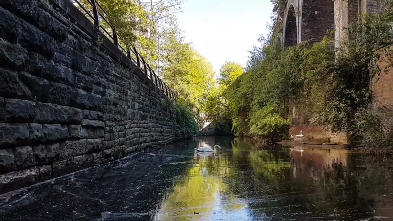 The Man giving a Historic Tour down the River Irwell... on a Canoe ...